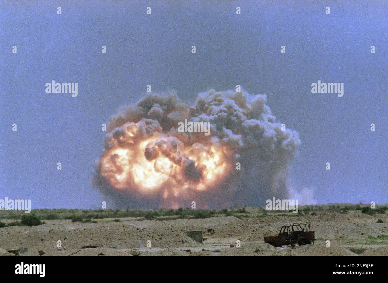 Greater Burgan oil field, flames of a burning oil field shown in March ...