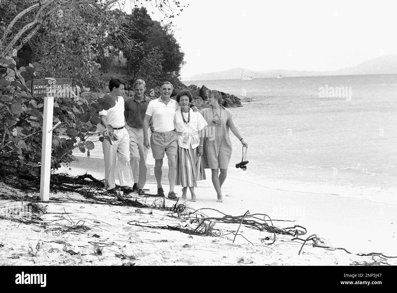 Walter Mondale and his family stroll the beach at Caneel Bay on St ...