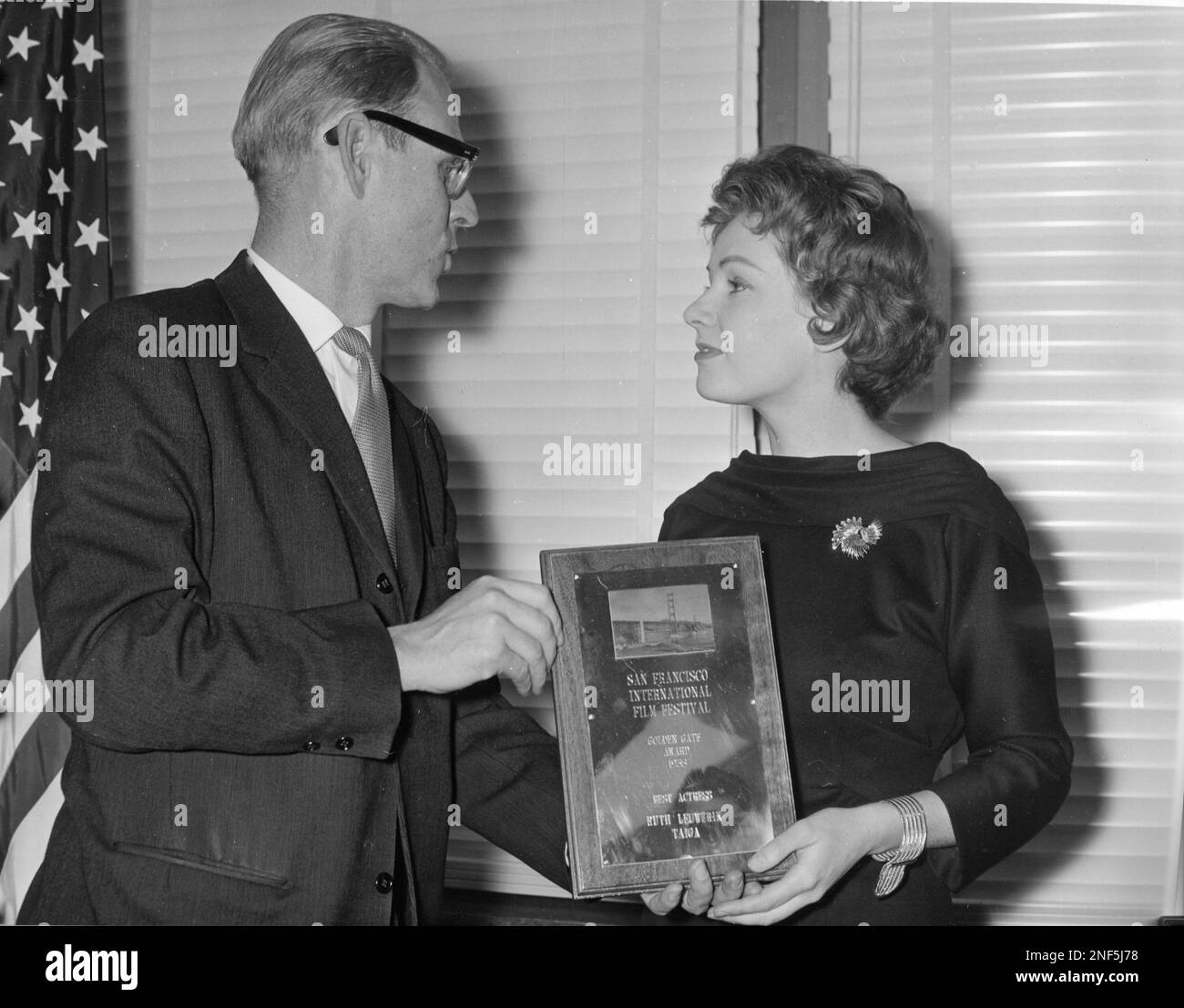 West German actress Ruth Leuwerik, holds her award as best woman ...
