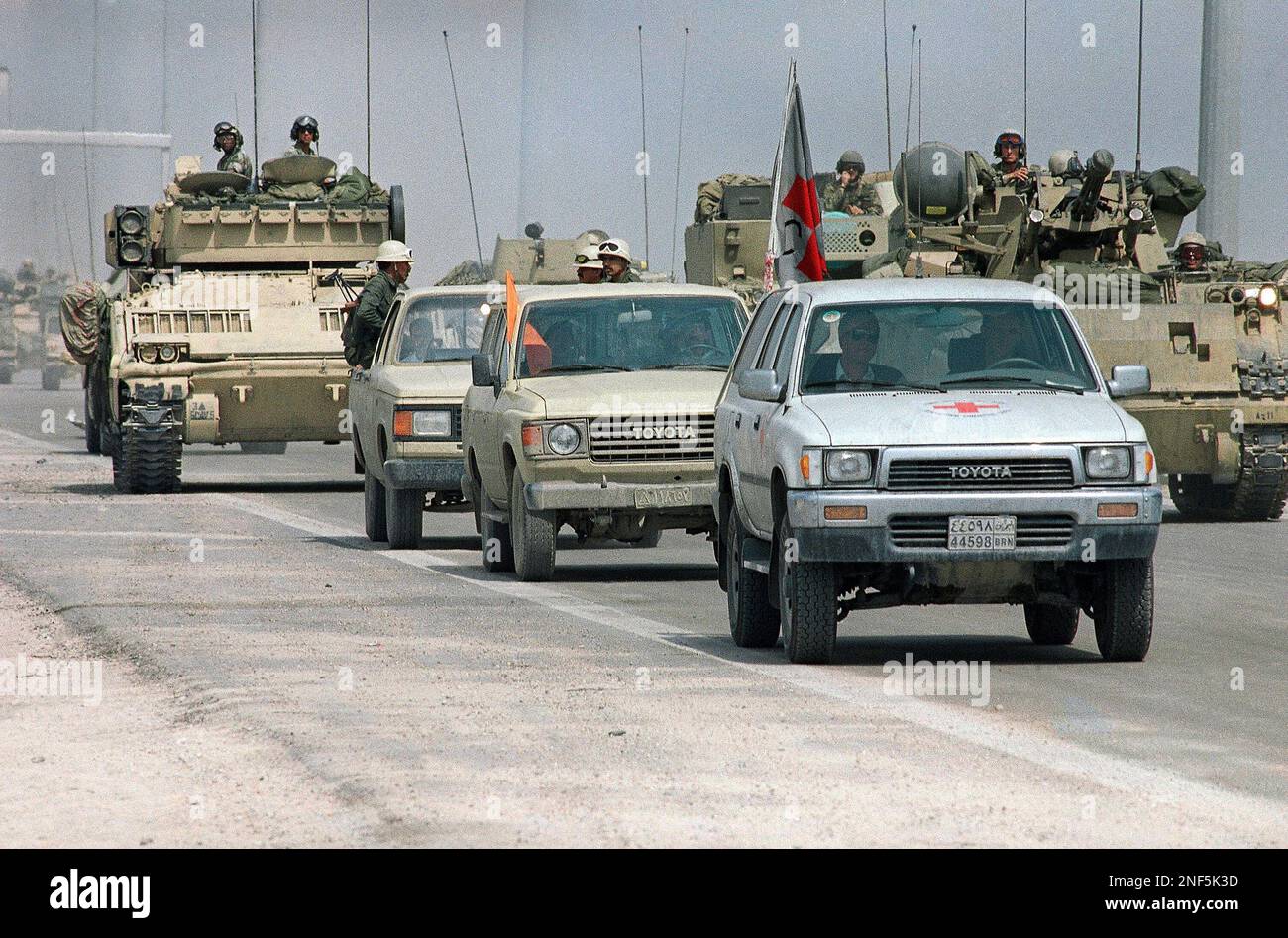 A convoy of vehicles carrying Iraqi military personnel International ...
