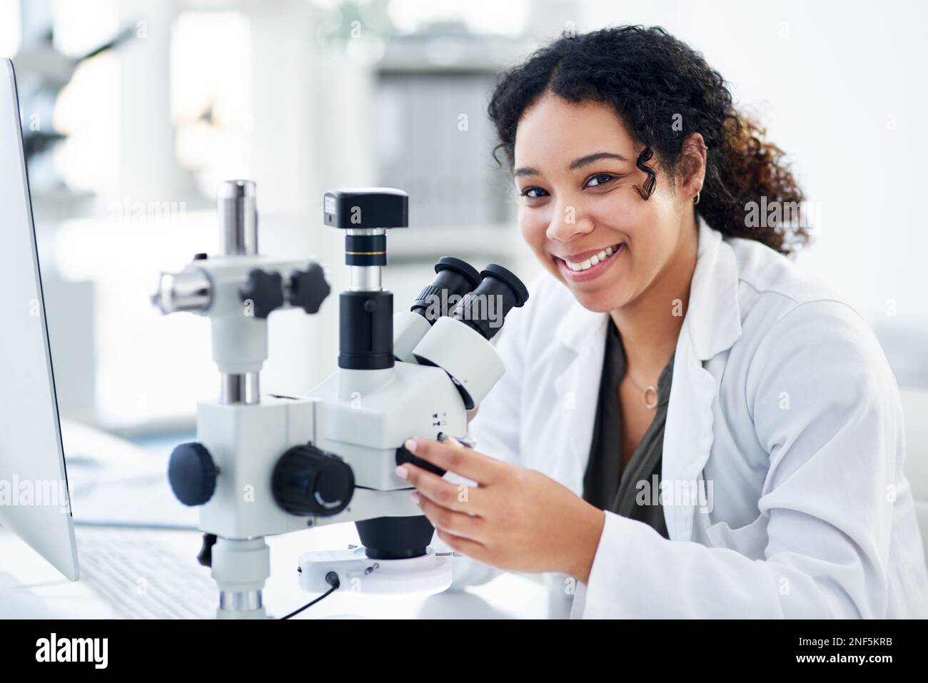 I discover something new everyday. a young female scientist using a ...