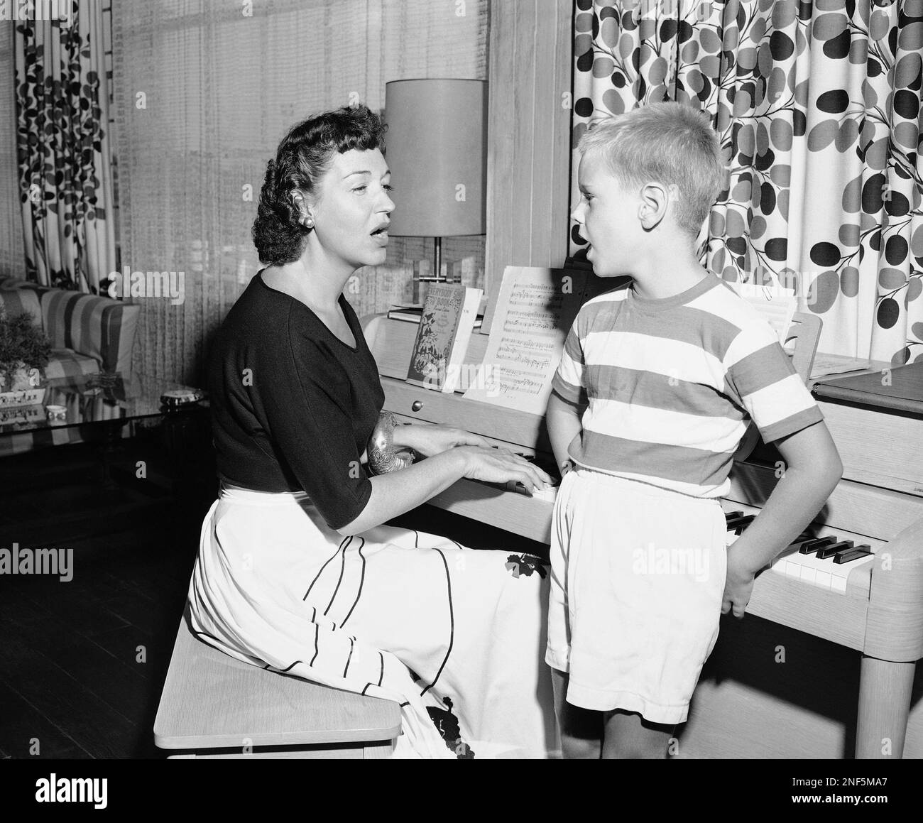 Rise Stevens and her son, Nicky Surovy, do a little harmonizing at the ...