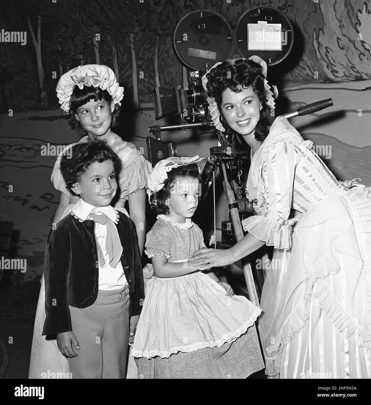 Actress Shirley Temple. Her hair has turned a rich brown. Her dresses ...