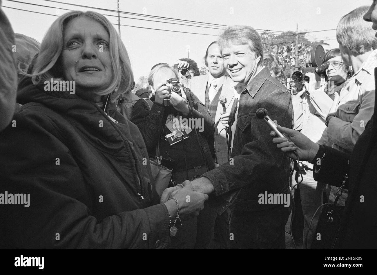 President-elect Jimmy Carter shakes hands with spectators outside the ...