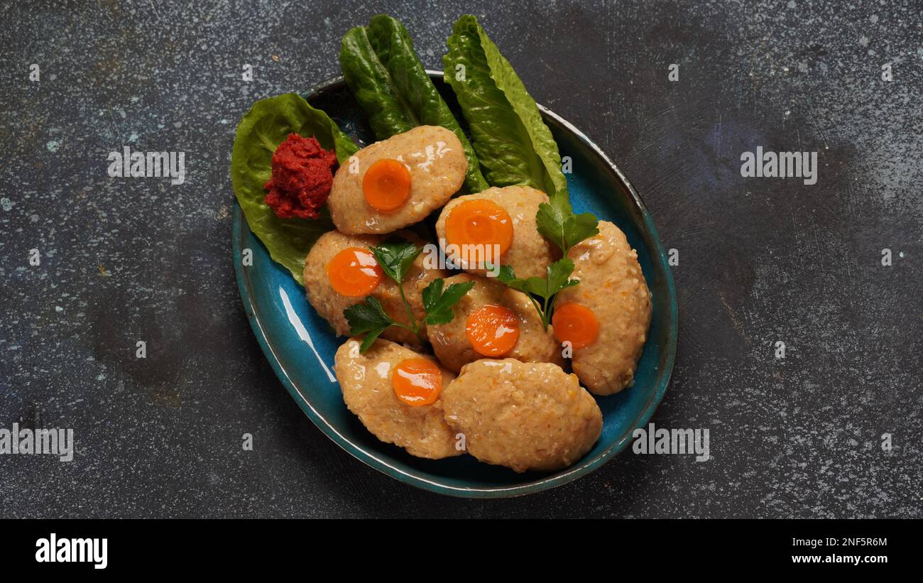 Gefilte fish with carrots, lettuce, horse radish. Passover traditional ...