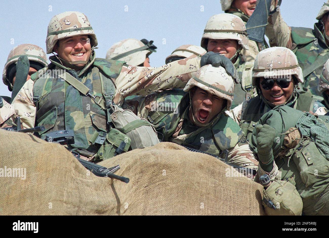 Members of the Army?s 82nd Airborne Division celebrate on the back of a ...