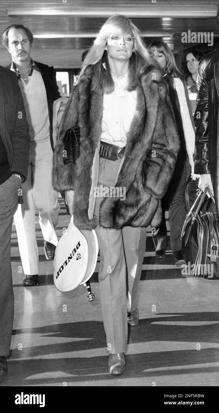 Farrah Fawcett, complete with tennis rackets, at Londons Heathrow ...