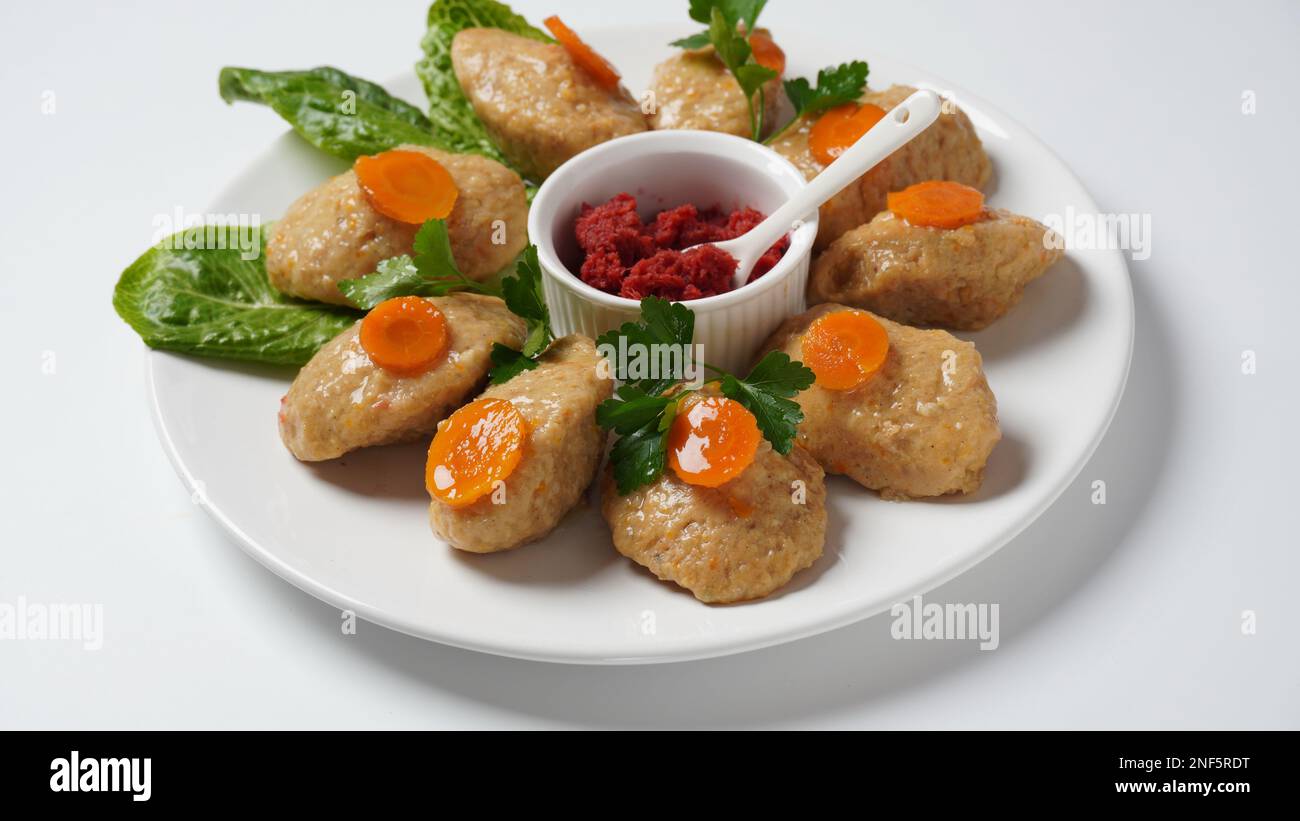 Gefilte fish with carrots, lettuce, horse radish. Passover traditional ...