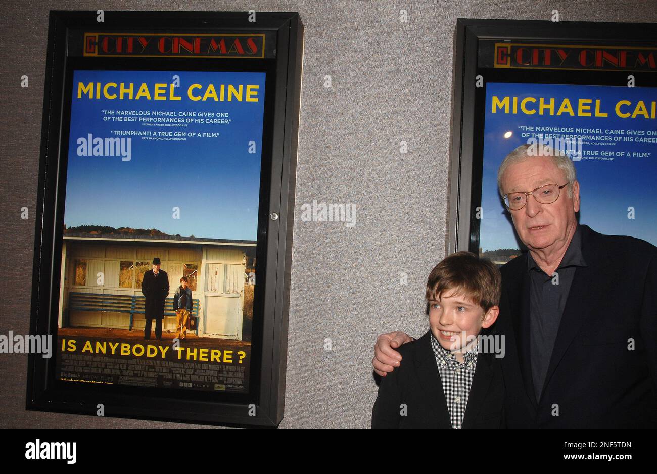 Actors Bill Milner, left, and Michael Caine arrive to the premiere of ...