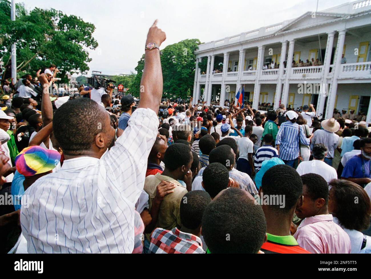 Thousands of Haitians gather outside the army headquarters in Port-au ...