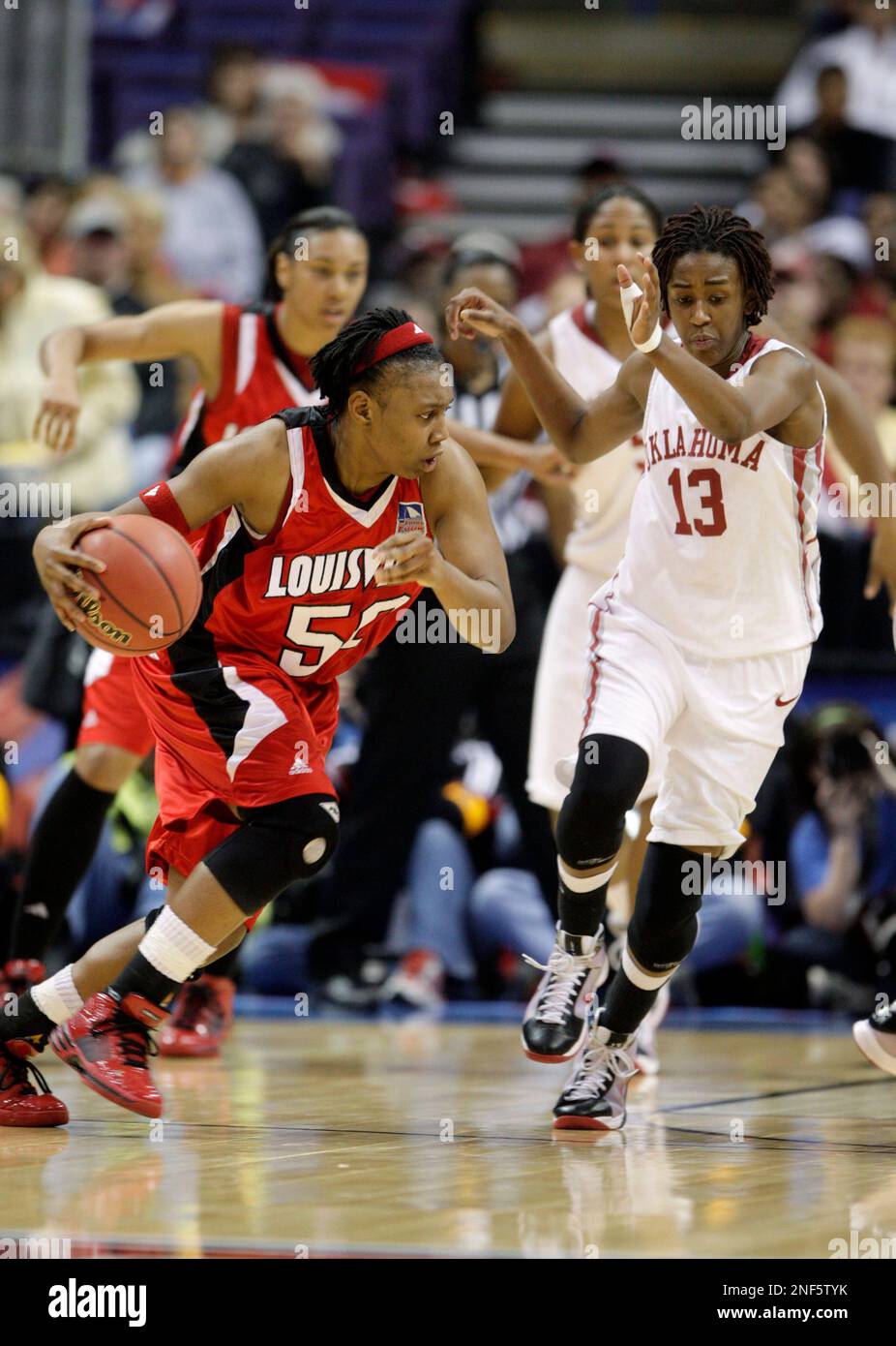 Louisville's Deseree Byrd, left, drives on Oklahoma's Danielle Robinson ...