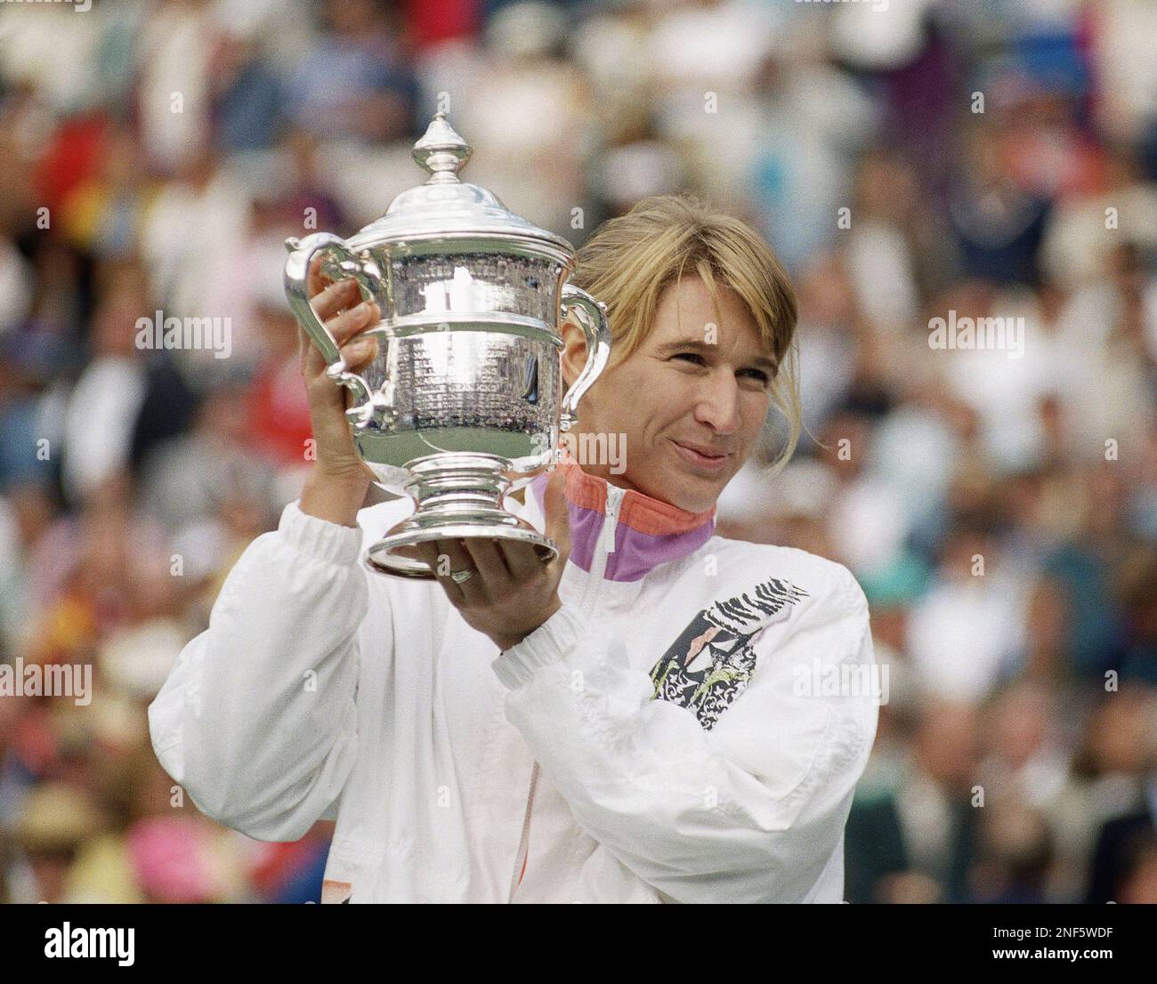 Professional sportsperson smiling holding standing looking away hi-res ...