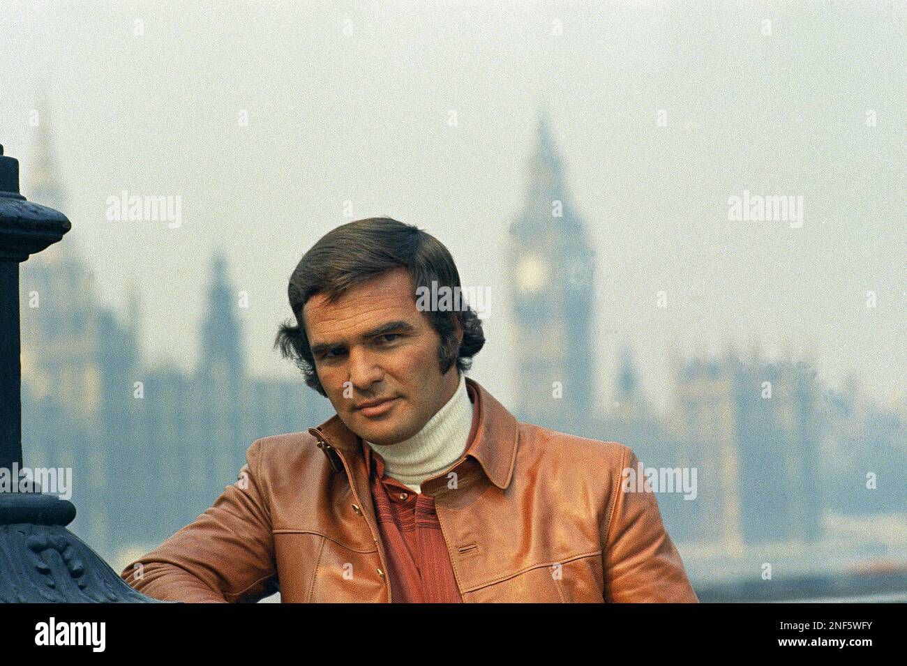 American actor Burt Reynolds is shown in London against a backdrop of ...