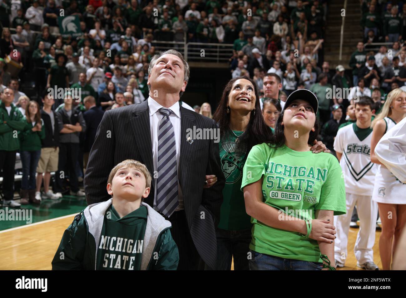 Michigan State basketball coach Tom Izzo watches a tribute video with ...