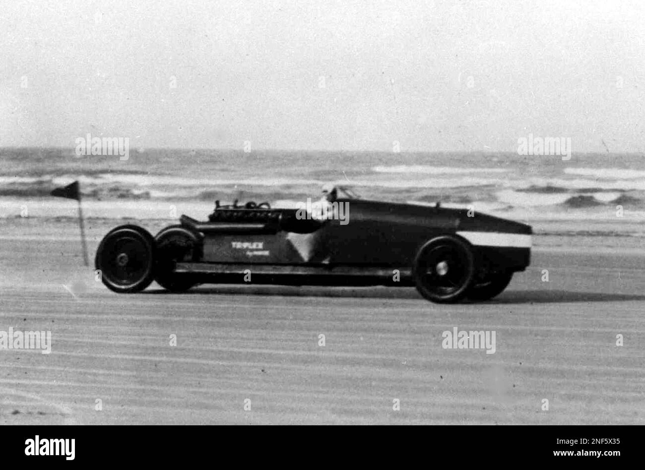 American racer Ray Keech in the White Triplex Special as he passes the ...