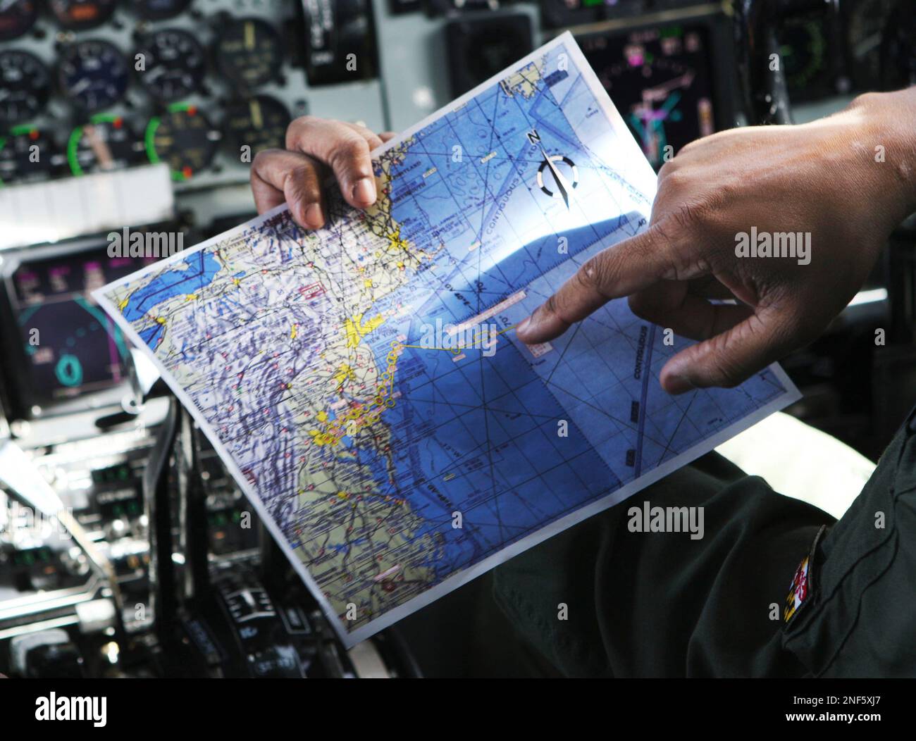 Lt. Col. Robert Blake, a member of the 459th Air Refueling Wing, points ...