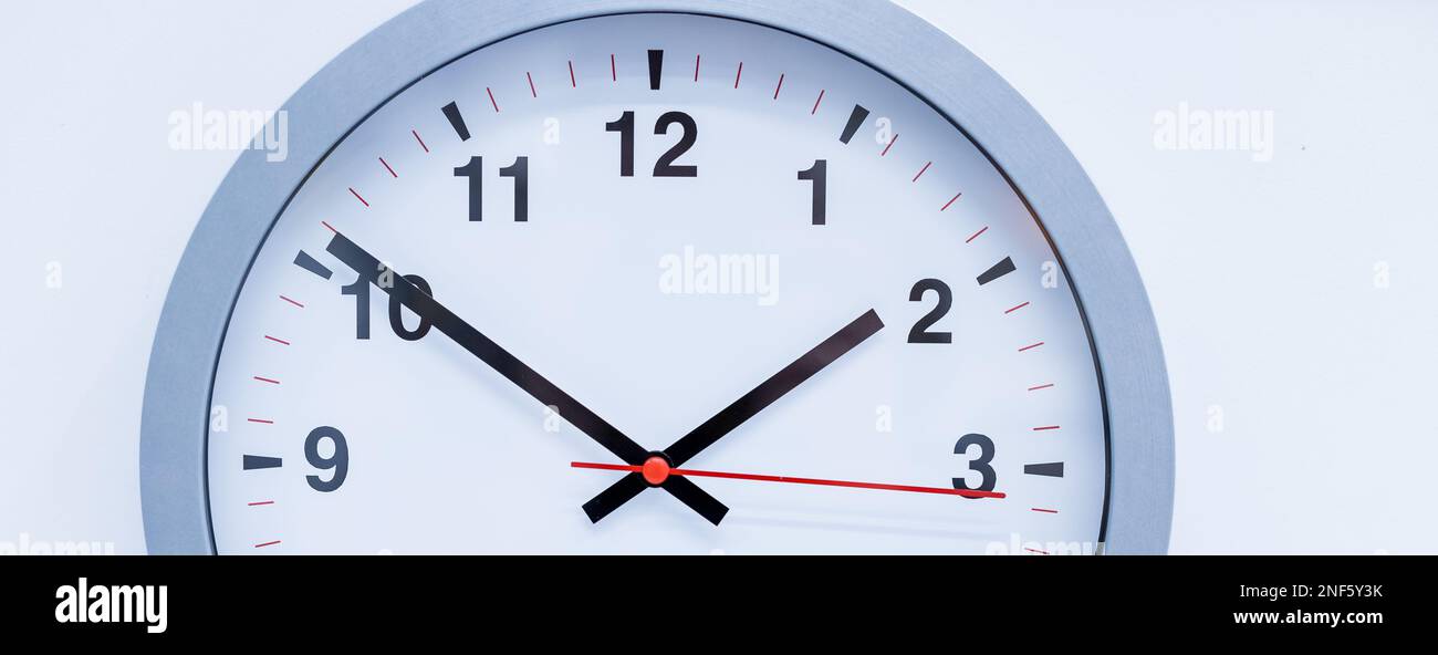 part of silver big analogue plain wall clock on trendy pastel blue ...