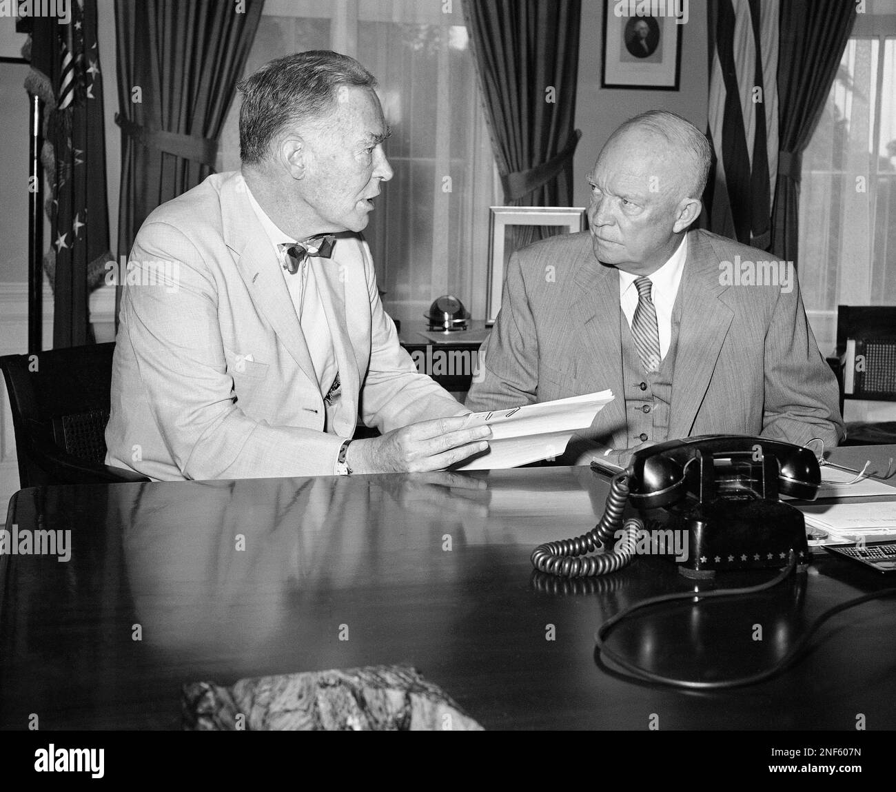 Secretary of State Christian Herter, left, gestures with a thumb up as ...