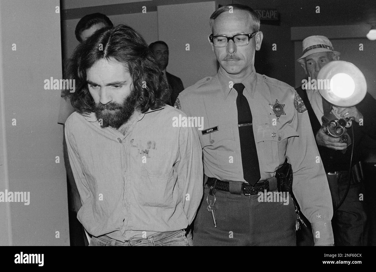 Charles Manson, leader of a hippie cult, stares at the floor, Oct. 6 ...