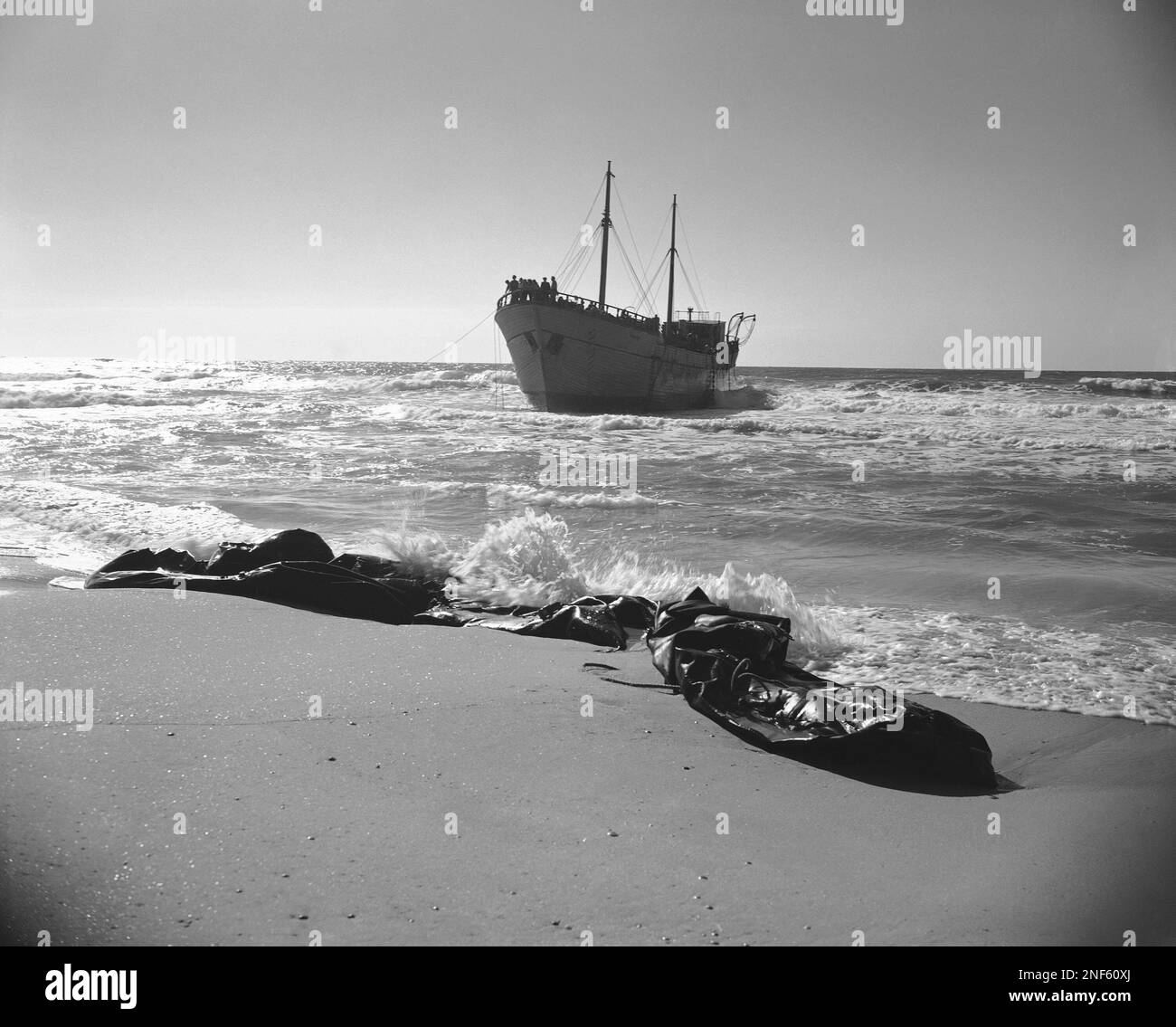United States Navy rubber rafts on the beach near the ship on Dec. 3 ...