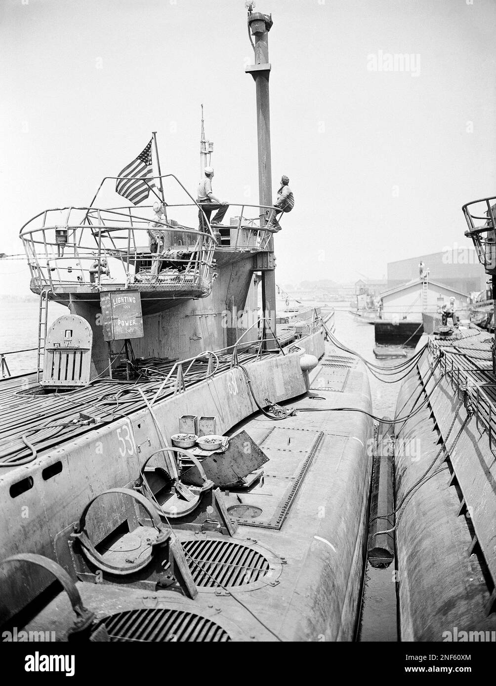 Conning tower and snorkel on captured German U-234 submarine tied up at ...