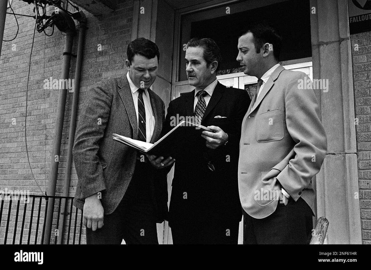 Conferring on the steps of the Collin County Courthouse after a judge ...