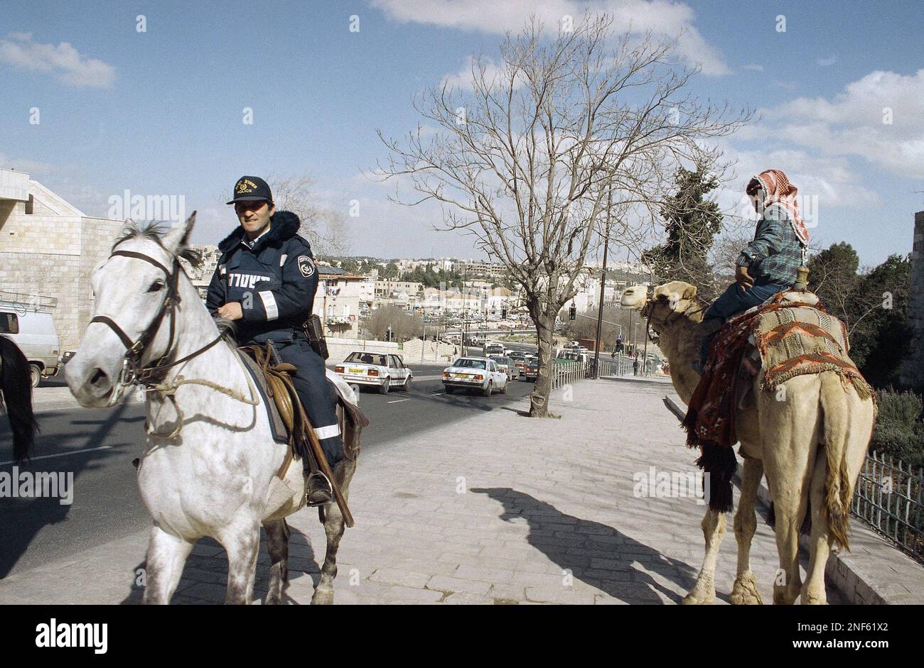 An Israeli mounted police officer patrolling near the old city of ...