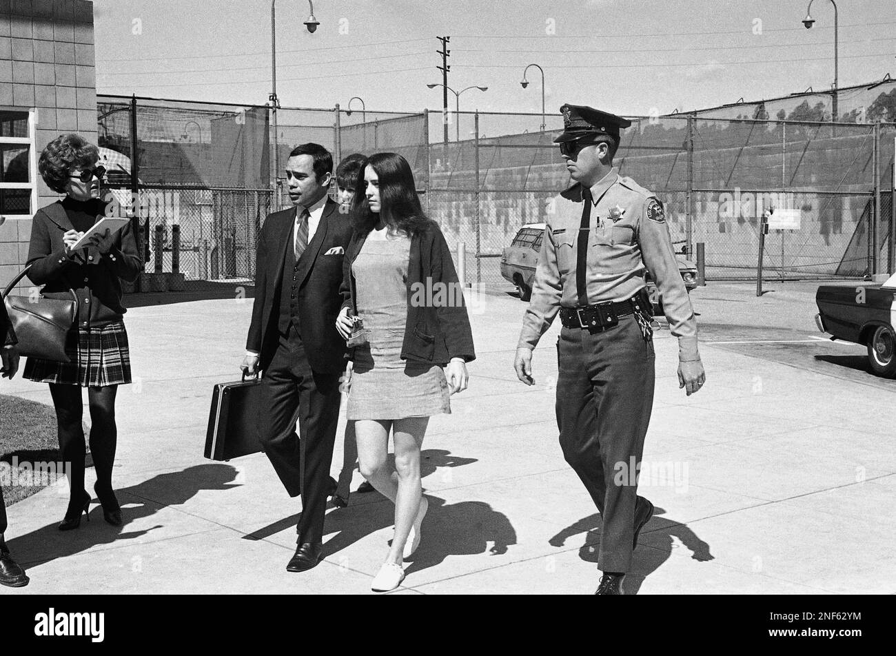 Susan Atkins is accompanied by her attorney, Richard Caballero, as she ...
