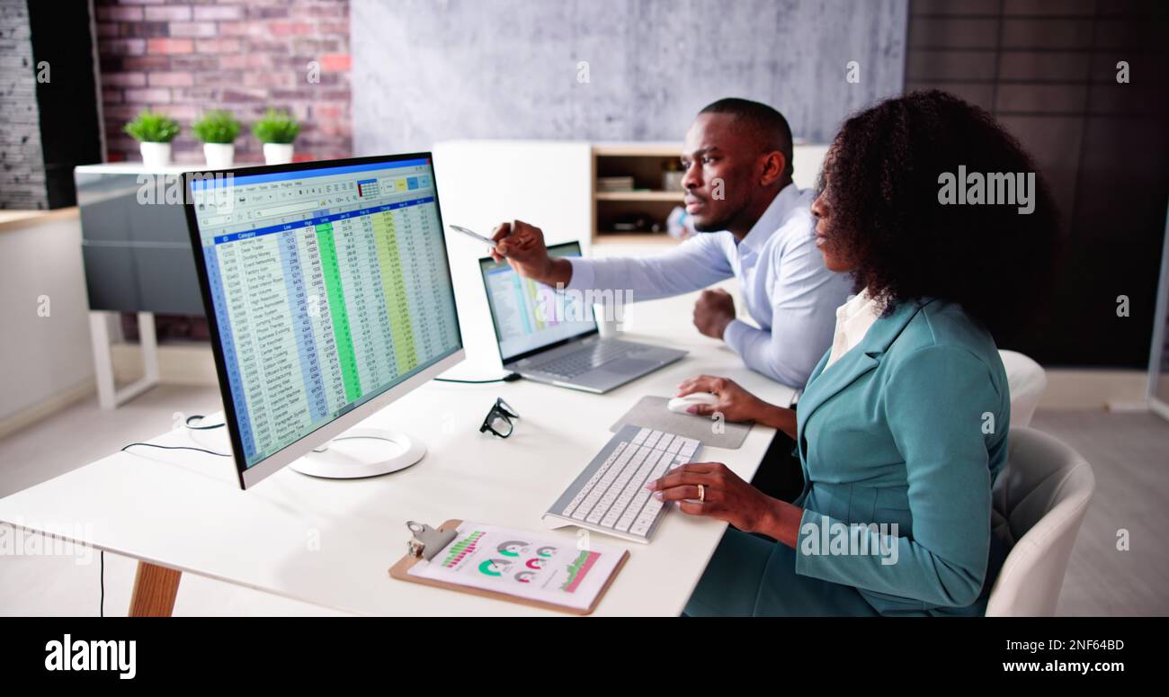 Analyst Employee Working On Spreadsheet Using Desktop Computer Stock ...