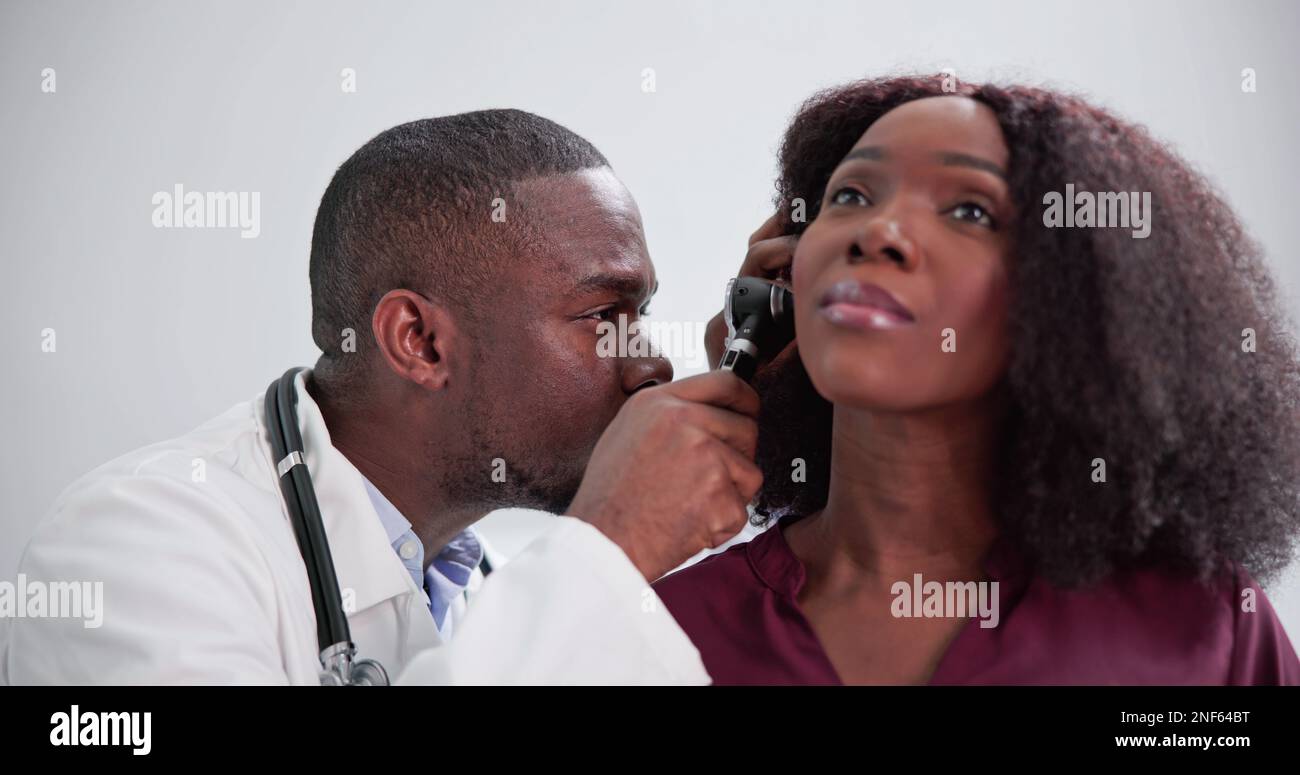 Otolaryngology Ear Check Using Otoscope. Doctor Examining Patient Stock ...