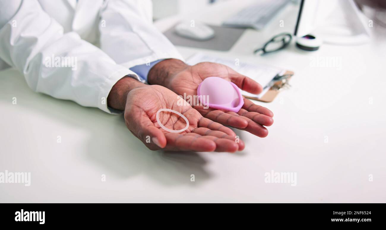 Gynecologist Consulting Woman On Diaphragm Contraception And Birth ...