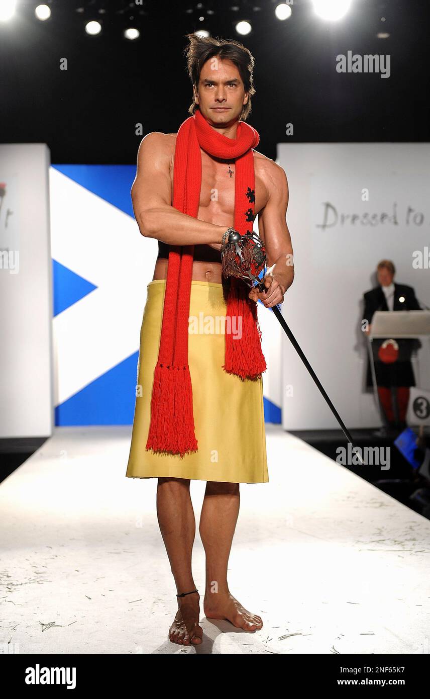 Model Marcus Schenkenberg walks the runway at the 7th Annual 'Dressed ...