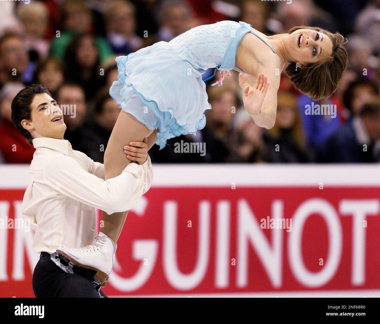 Vanessa Crone and Paul Poirier, of Canada, skate in the ice dancing ...
