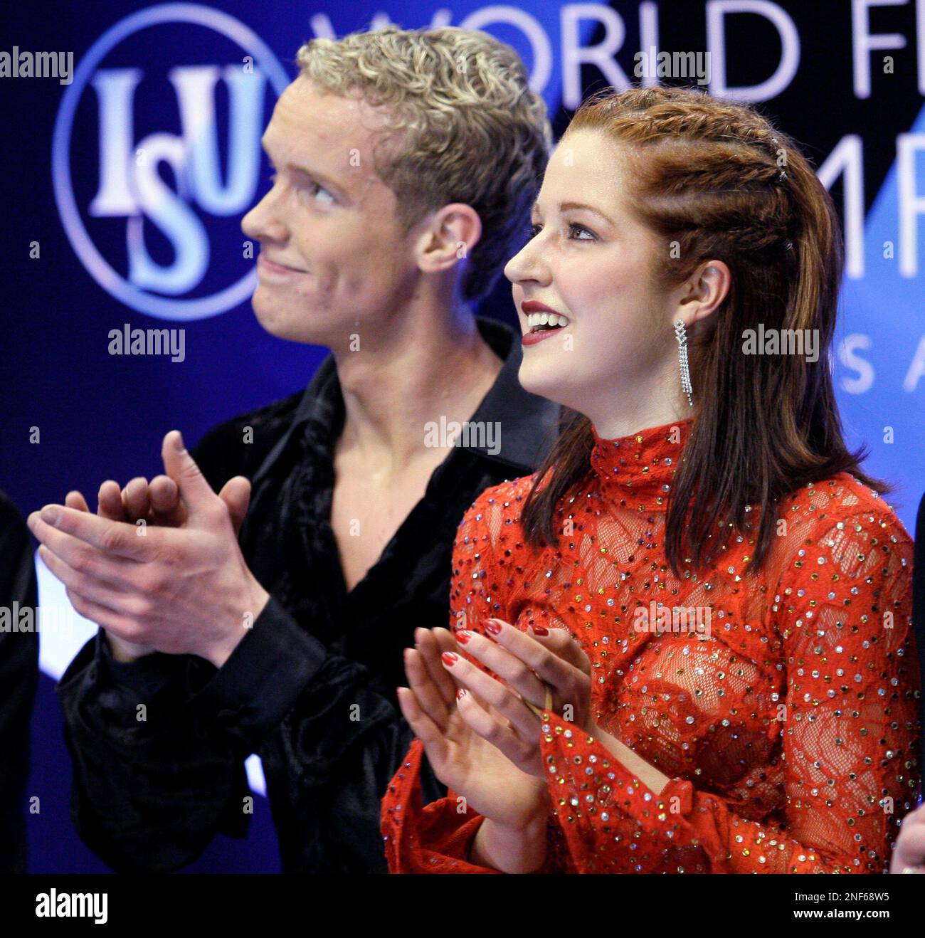 Emily Samuelson and Evan Bates, of the United States, look up at their ...