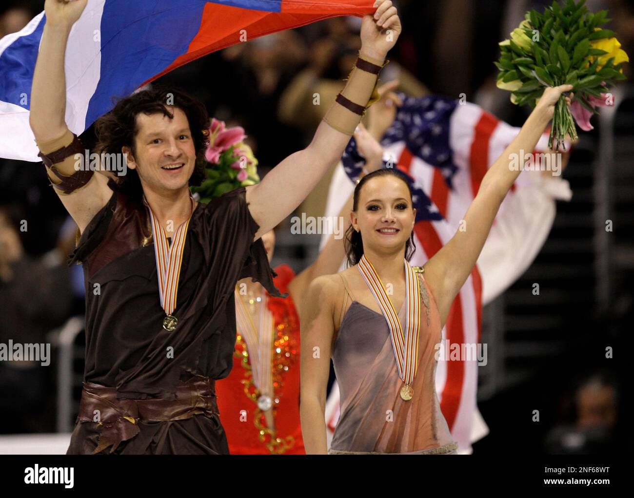 Oksana Domnina and Maxim Shabalin of Russia, skate around the ice after ...