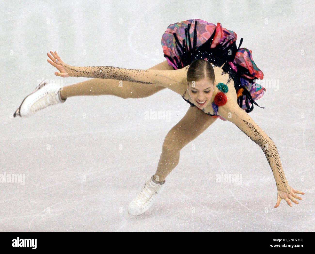 Carolina Kostner, of Italy, loses her footing as she skates during the ...