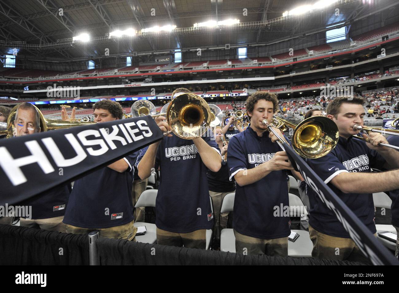 Members of the Connecticut band plays before a game against Purdue at a ...