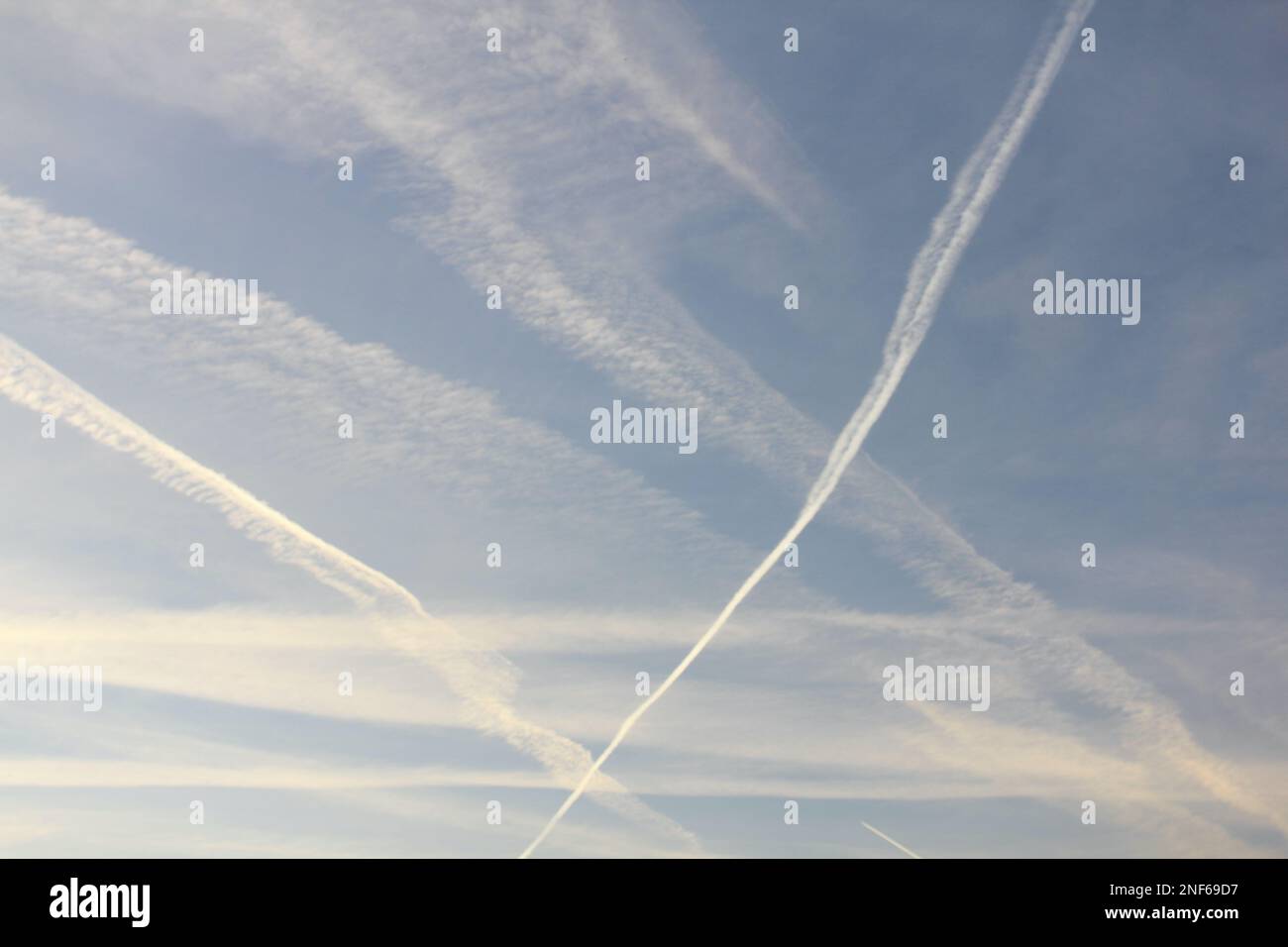 Contrails of jet engines left their traces in the sky blue Stock Photo ...