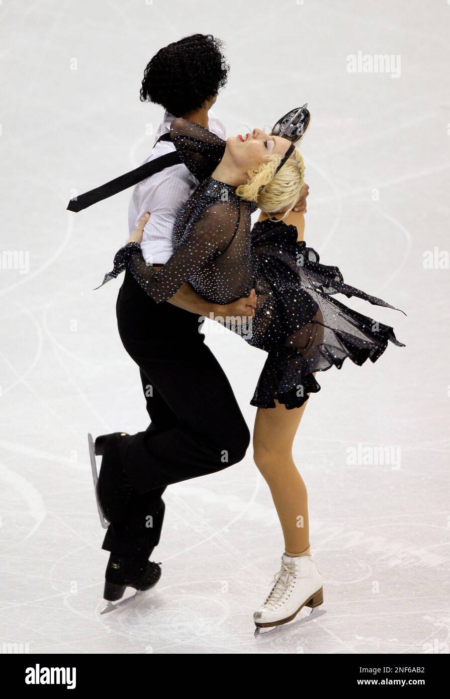Leonie Krail and Oscar Peter, of Switzerland, skate during the ice ...
