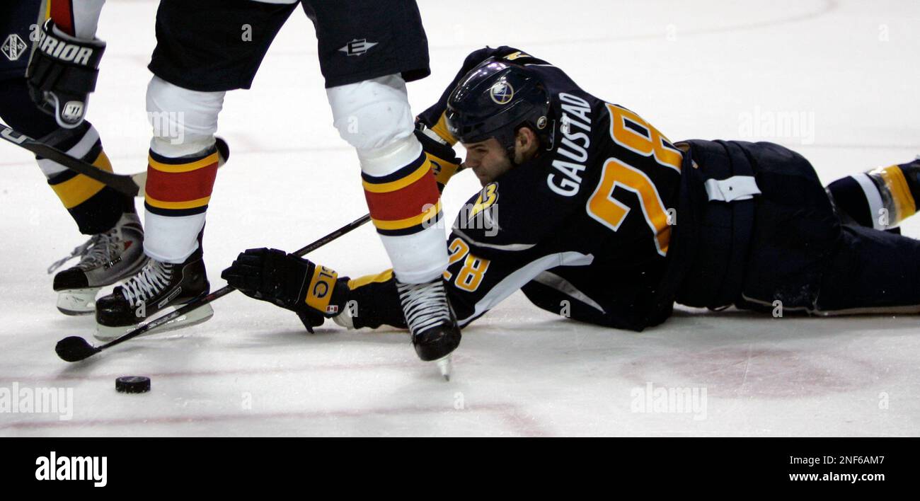 Buffalo Sabres' Paul Gaustad (28) passes between the legs of Florida ...