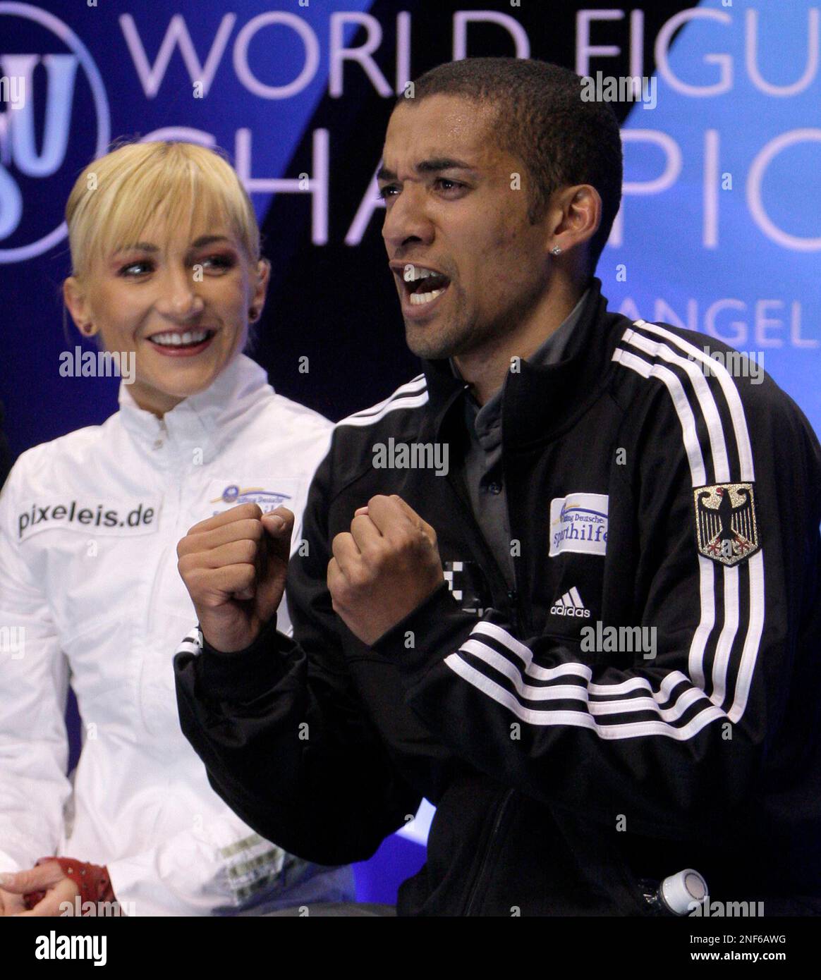 Aliona Savchenko and Robin Szolkowy of Germany react to their winning ...