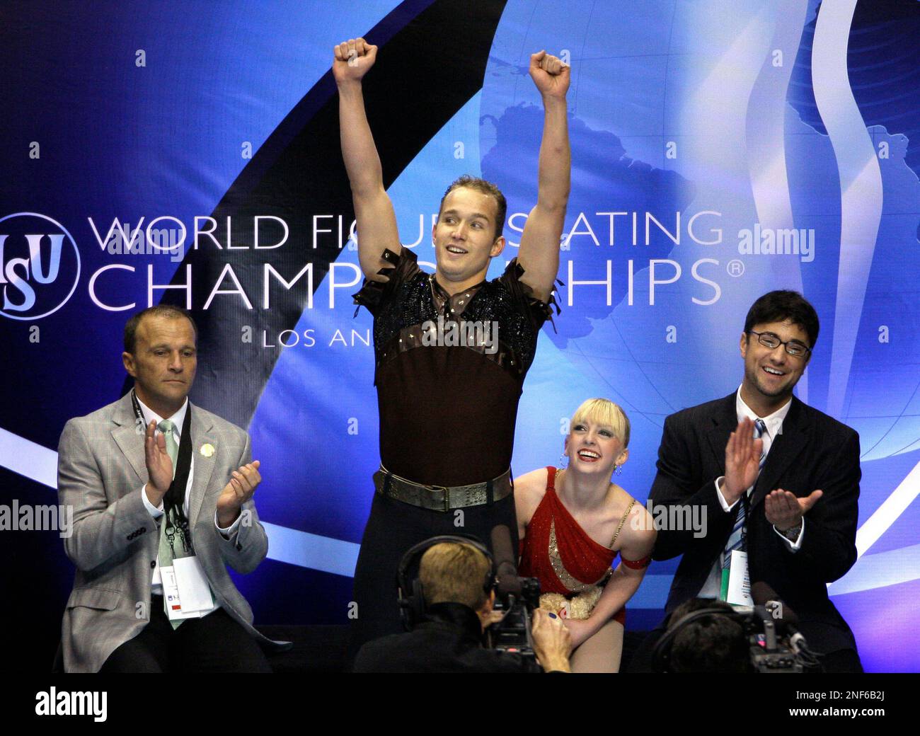 Caydee Denney and Jeremy Barrett, of the United States, react after ...