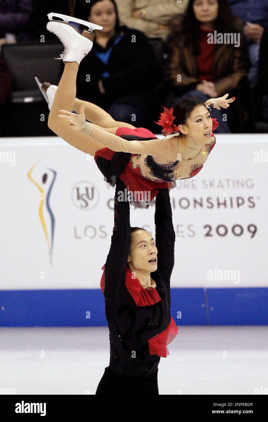 Pang Qing and Tong Jian, of China, skate during the pairs free skate ...