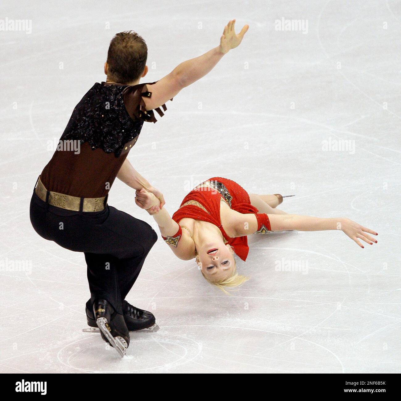Caydee Denney and Jeremy Barrett, of the United States, skate during ...