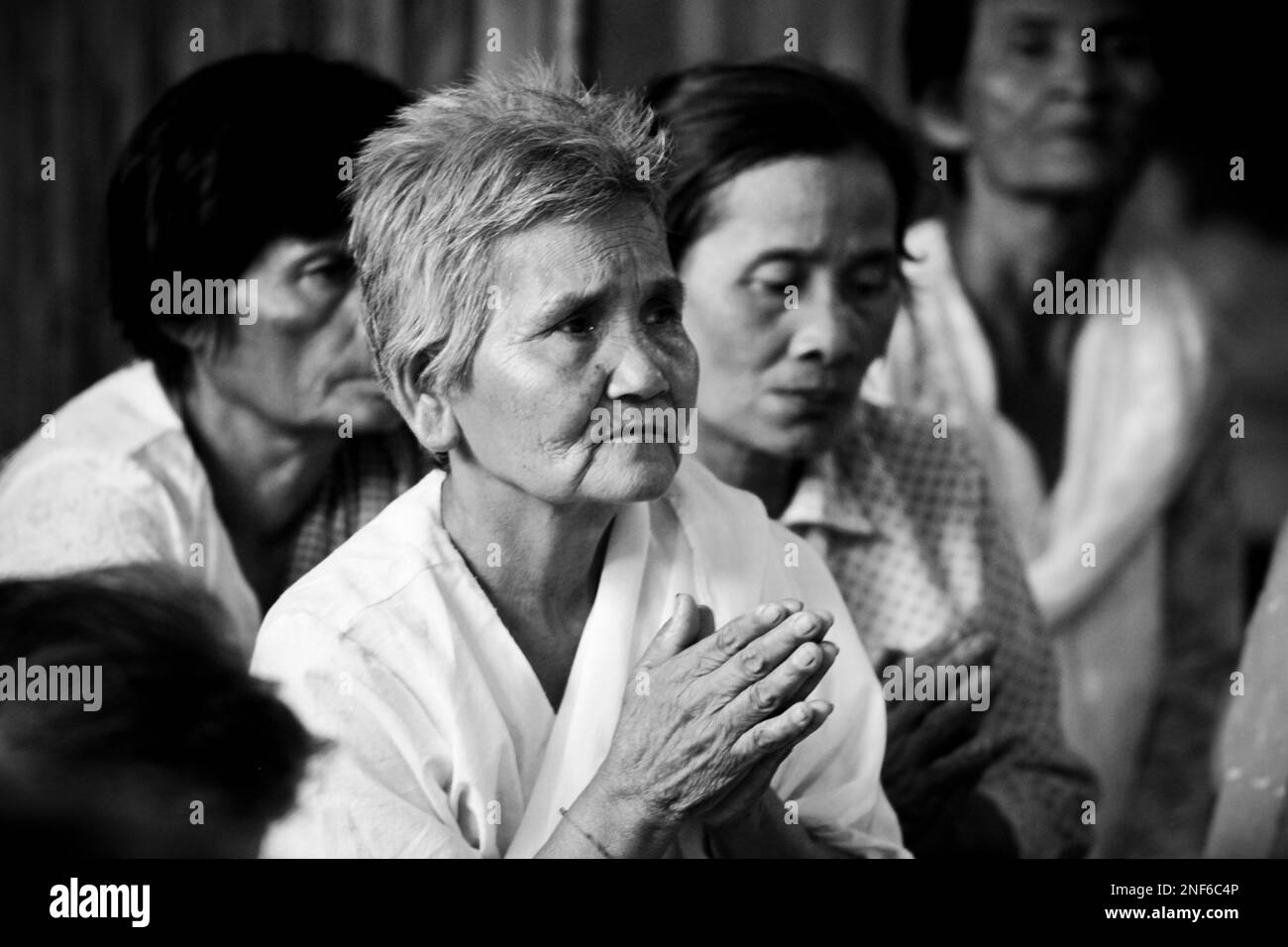 Cambodian women offer prayers during a wedding in former Khmer Rouge ...
