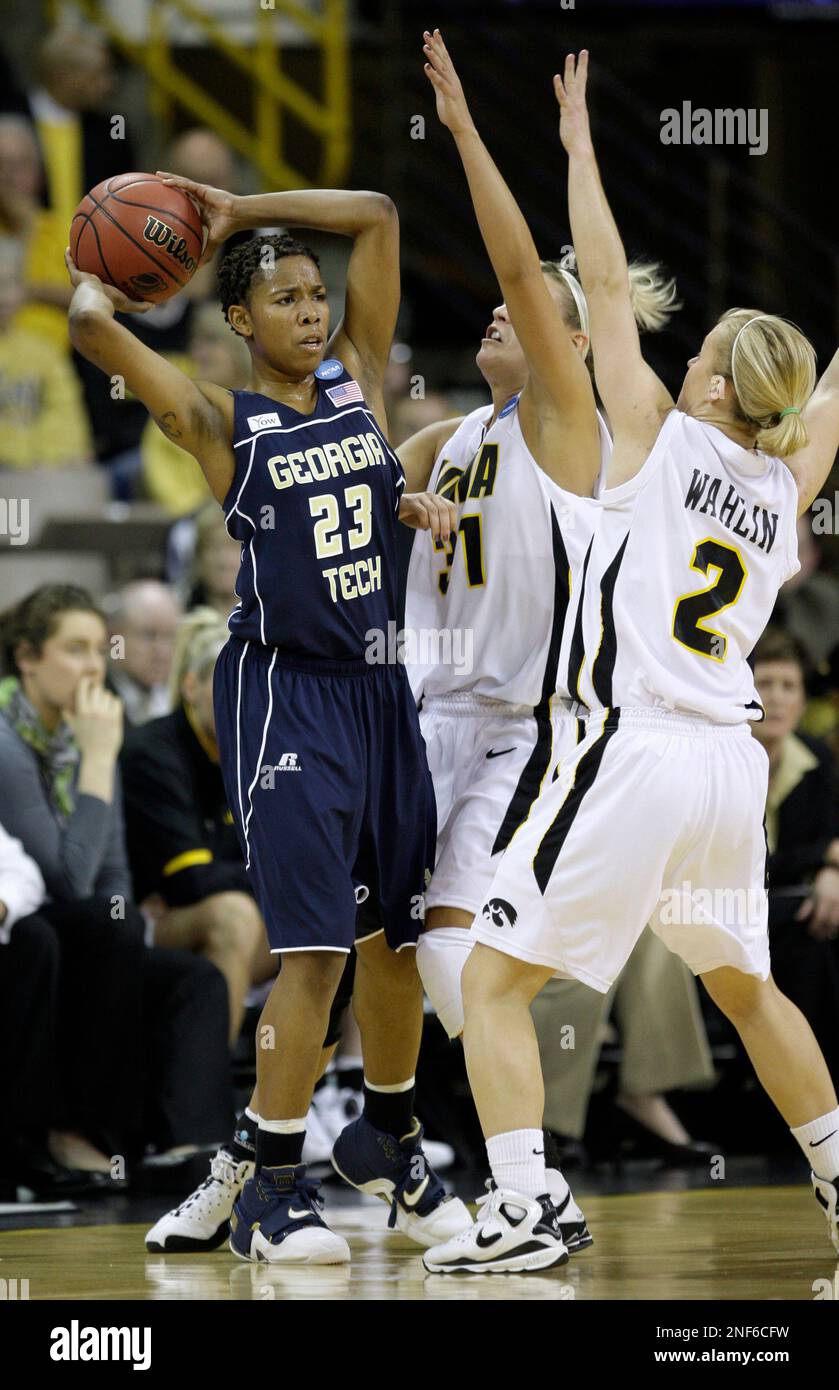 Georgia Tech's Deja Foster, left, looks to pass over Iowa's Hannah ...