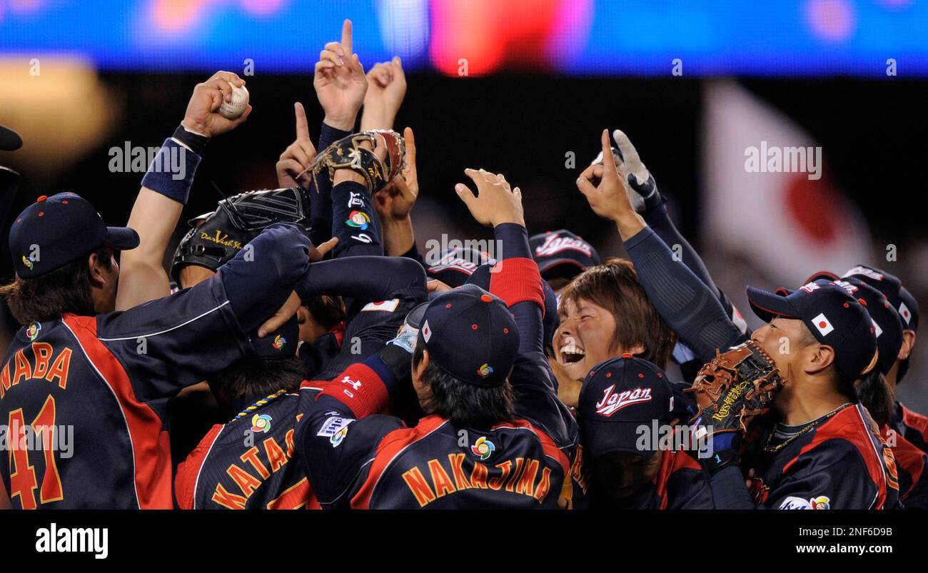 Japan celebrates after beating South Korea 5-3 in the final of the ...