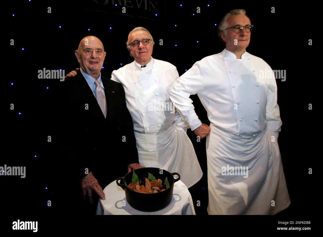 France's famous chef Alain Ducasse, center, flanked with Chef Paul ...