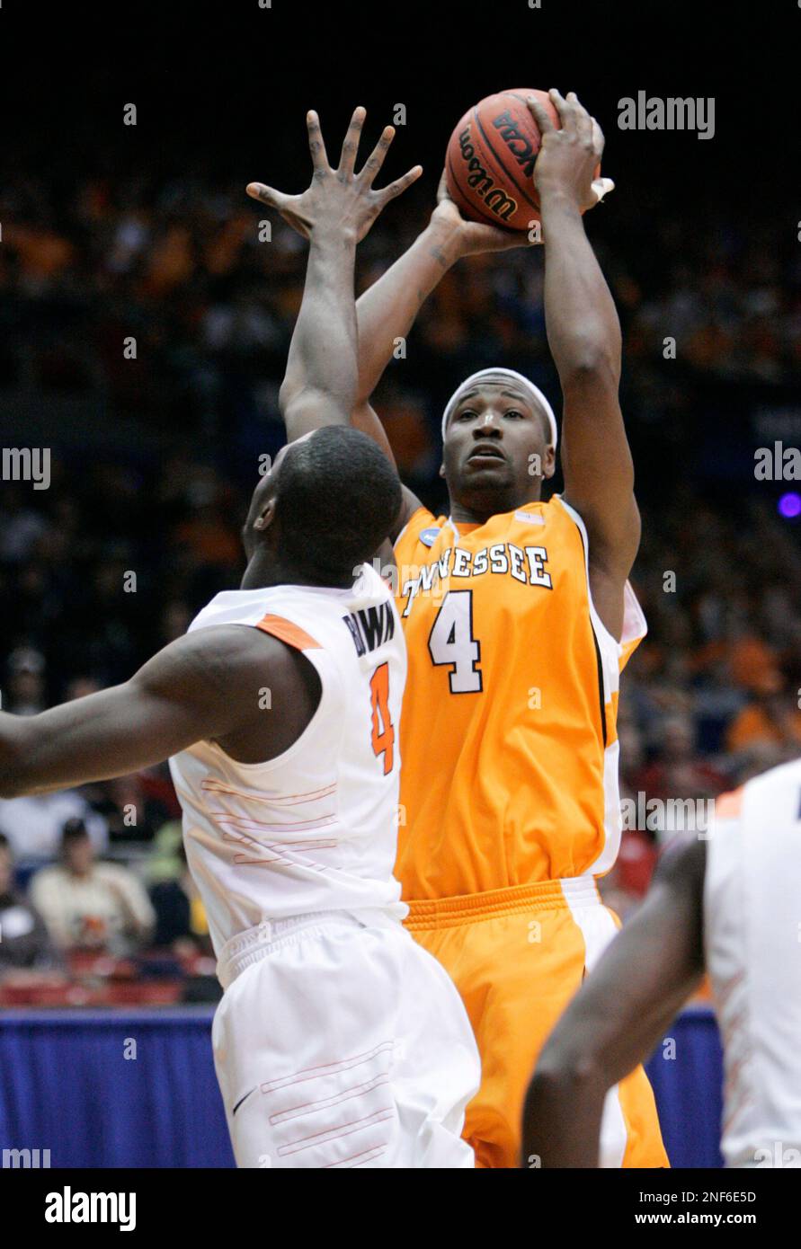 Tennessee's Wayne Chism (4) shoots over Oklahoma State's Anthone Brown ...