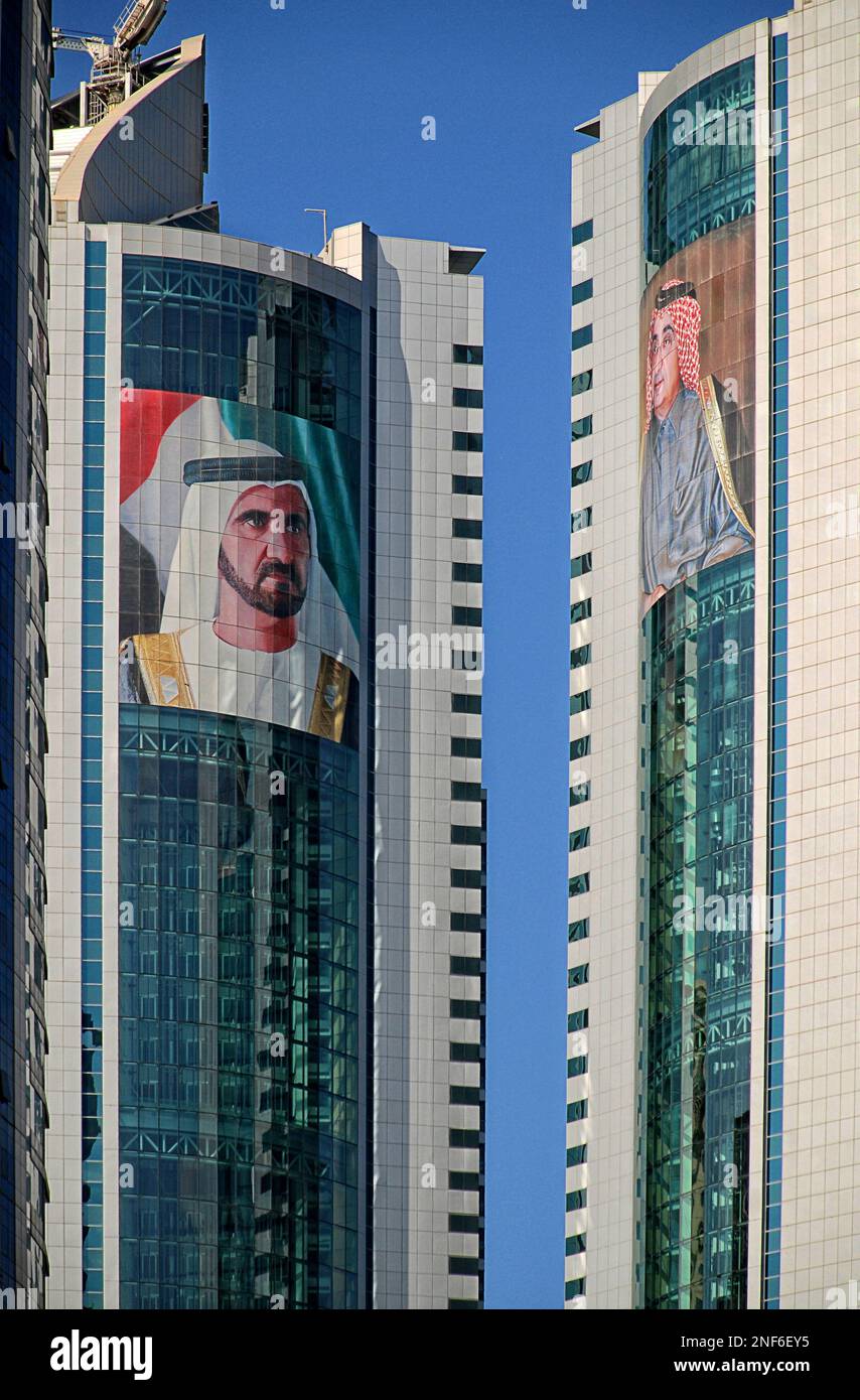 Portraits of Sheikh's on skyscrapers at Dubai marina Stock Photo - Alamy